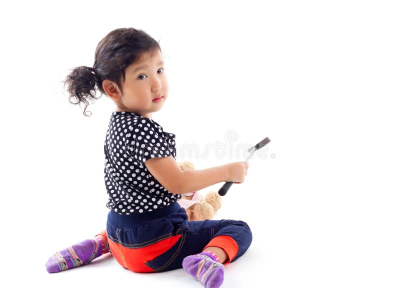 Cute Girl with Hammer and Doll Stock Photo - Image of equipment ...