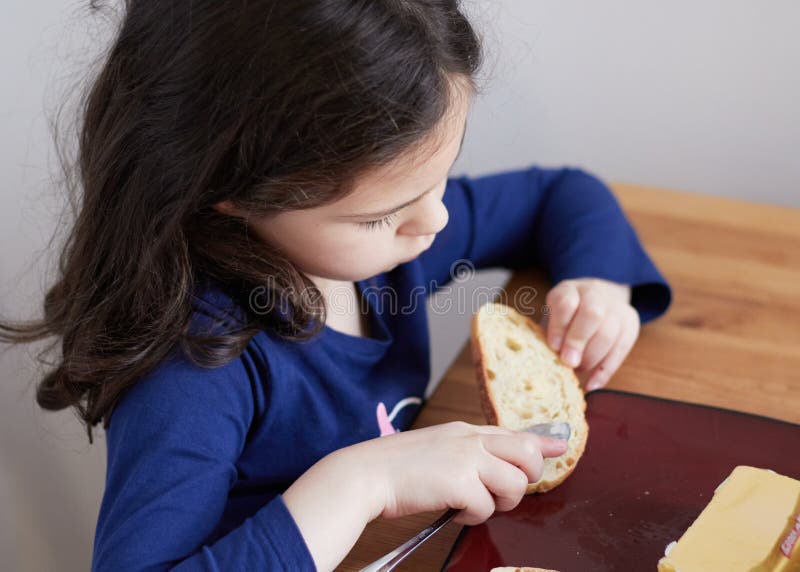 Cute Girl Having Snacks at Home Stock Photo - Image of morning ...