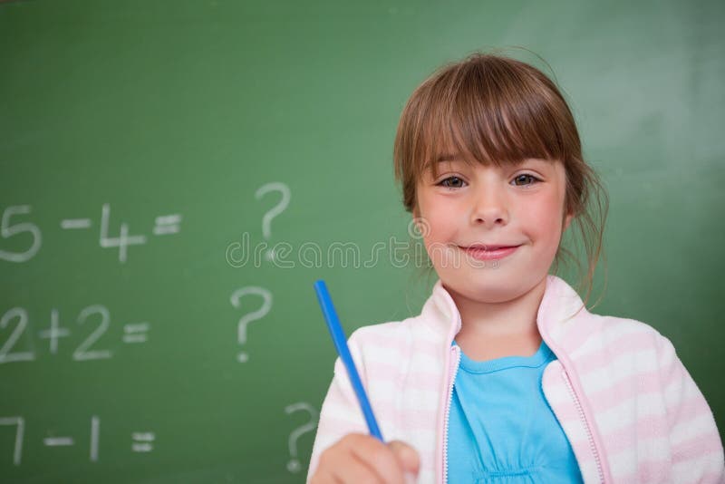 Cute girl holding a pen stock photo. Image of happiness - 22690962