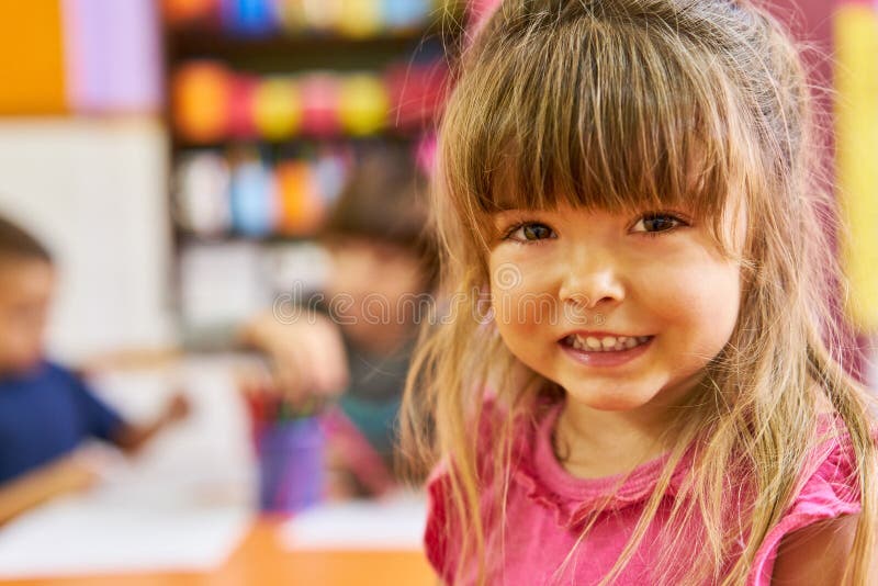 Girl in Kindergarten Group Holding Stock Image - Image of group ...
