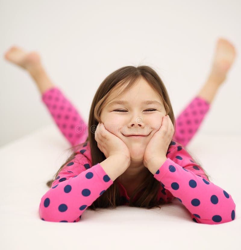 Cute Girl Laying on the Bed Stock Photo - Image of little, conversation ...
