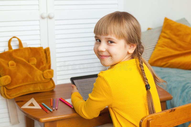 Cute Girl Learning at Home. Little Girl Using Tablet Stock Image ...