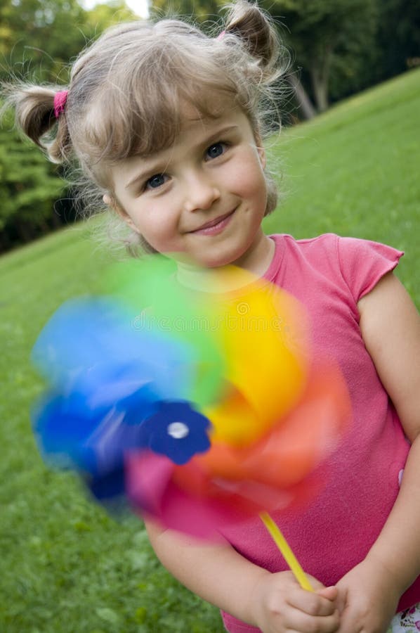 Cute Girl with Little Windmill Stock Image - Image of blue, portrait ...