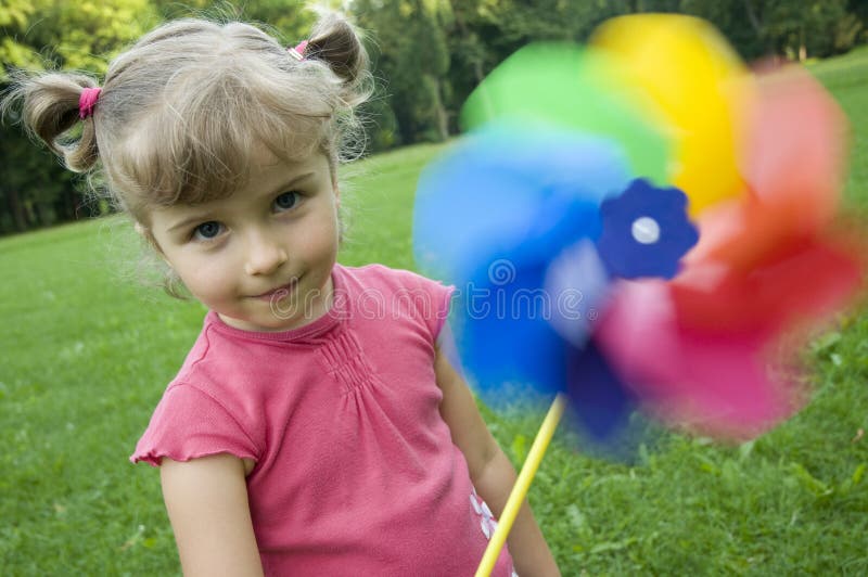 Cute Girl with Little Windmill Stock Image - Image of girl, hand: 6054457