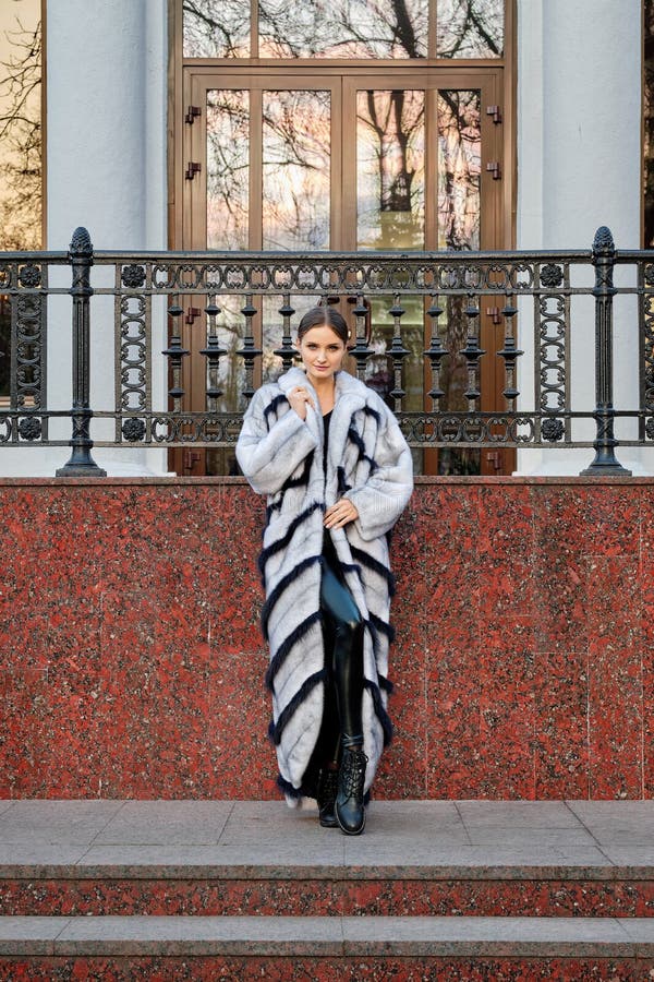 Cute girl in fur coat stock photo. Image of brunette - 222734188