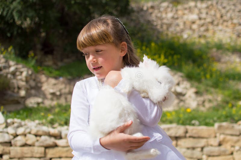 Cute girl with pet rabbit stock image. Image of dress - 38374783
