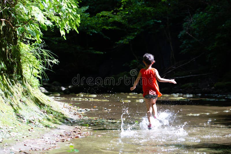 Girl Playing in a Mountain Stream Stock Photo - Image of mixed, alone ...