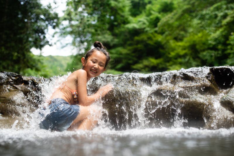 Girl Playing in a Mountain Stream Stock Image - Image of copy, child ...