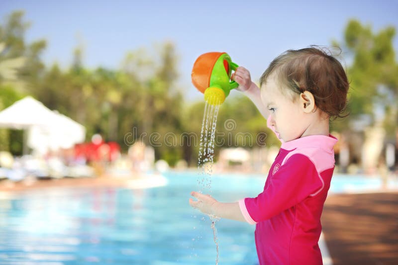 Cute Girl Playing in Swimming Pool Stock Image - Image of caucasian ...