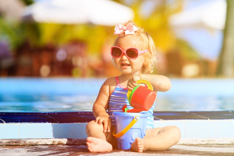 Cute Girl Playing in Swimming Pool at the Beach Stock Photo - Image of ...