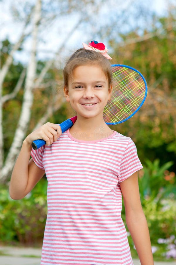 Cute Girl with Racket Outdoors Stock Photo - Image of years, looking ...