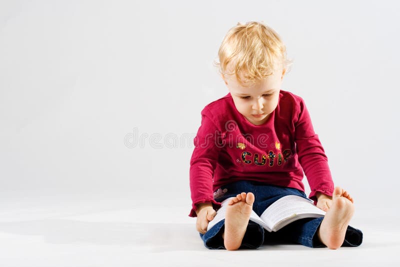 Cute girl reading the book stock image. Image of studio - 2855175