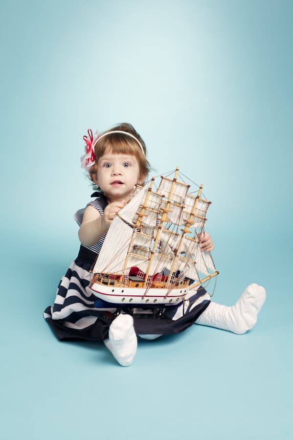 Cute Girl Sailor with Model Ship Stock Photo - Image of dream, captain ...