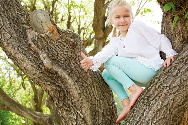 Cute Girl Sitting on a Tree in Summer Stock Photo - Image of spring ...