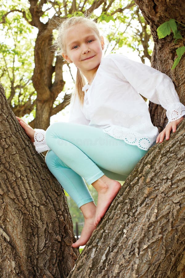 Cute Girl Sitting on a Tree in Summer Stock Photo - Image of female ...
