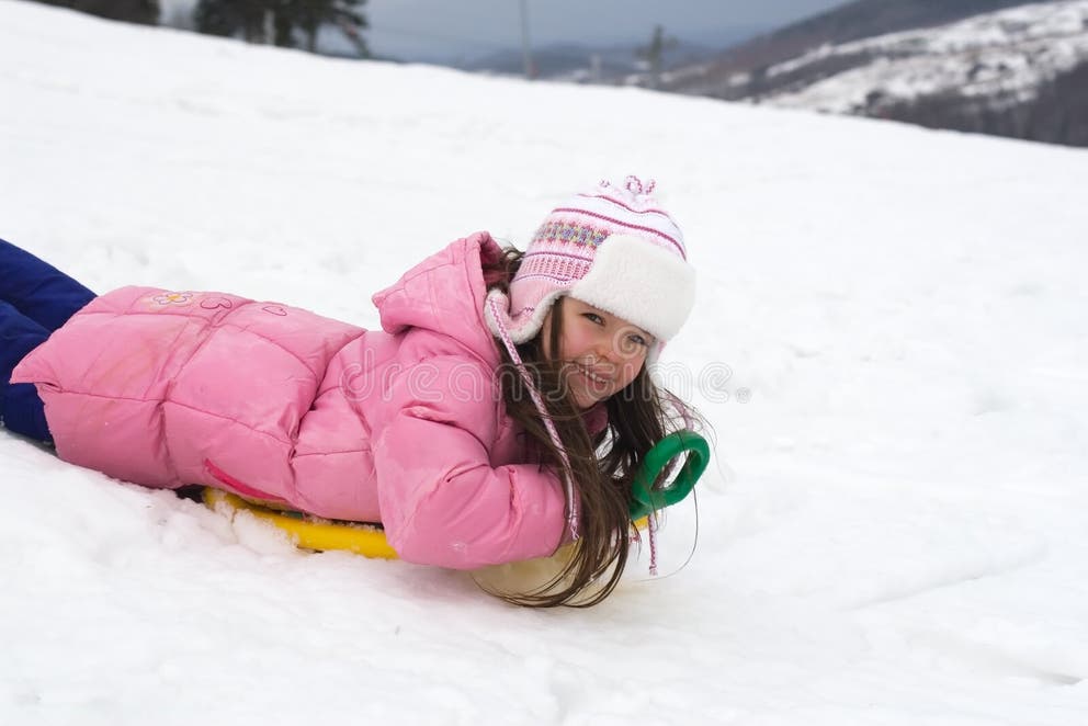 Cute Girl on a Snow Sled stock image. Image of happily - 1871981