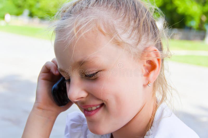 Cute Girl Talking by Cellular Stock Photo - Image of nine, preschooler ...