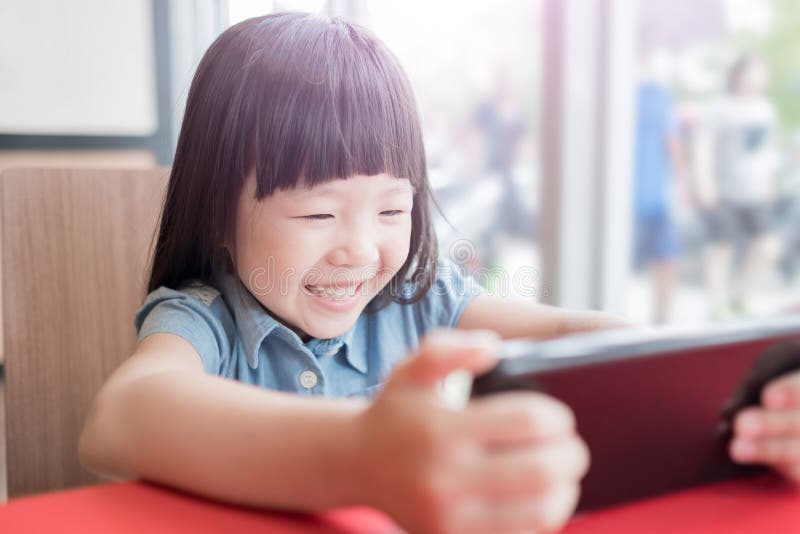 Cute girl use phone stock image. Image of media, adorable - 94009527