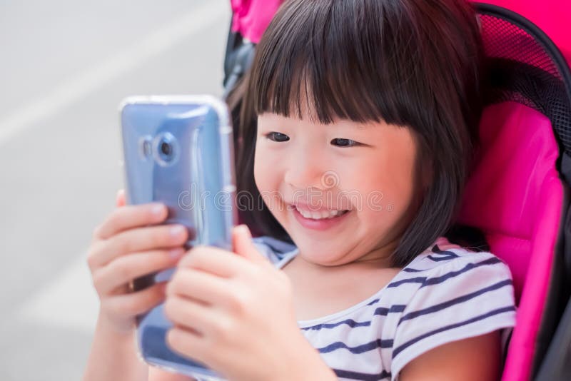 Cute girl use phone stock photo. Image of japan, childhood - 117108184