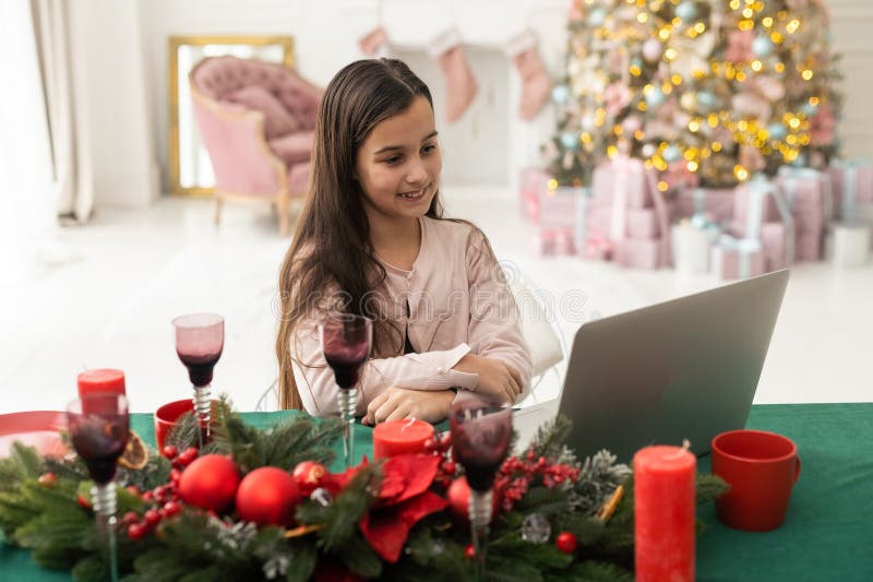 Cute Girl Using Computer by Christmas Tree Stock Image - Image of ...