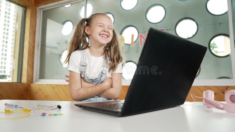 Smart Cute Girl Using Laptop while Looking and Laughing at Camera ...