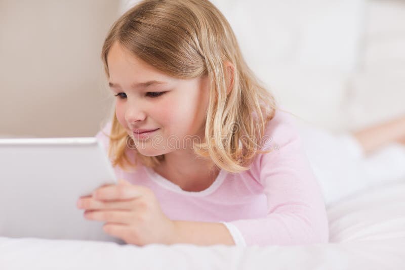 Cute Girl Using a Tablet Computer Stock Photo - Image of small ...