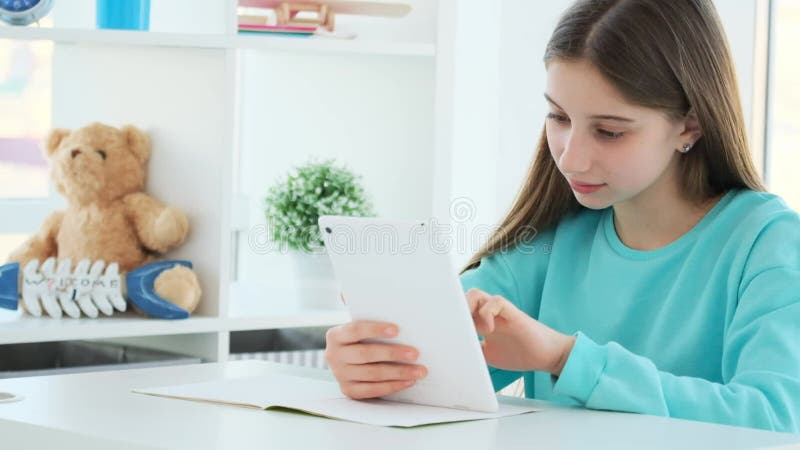 Cute girl using tablet stock footage. Video of hands - 190065646