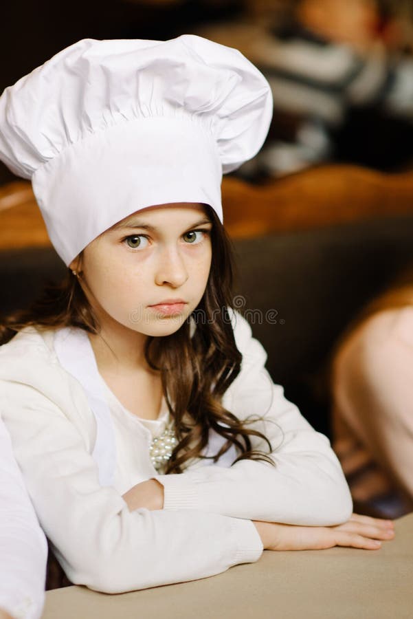 Cute Girl in a White Cap is a Chef`s Chef Stock Photo - Image of person ...