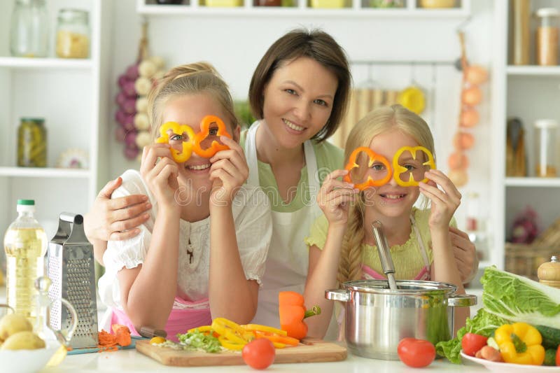 Cute Girls with Mother Cooking in Kitchen Stock Photo - Image of smile ...