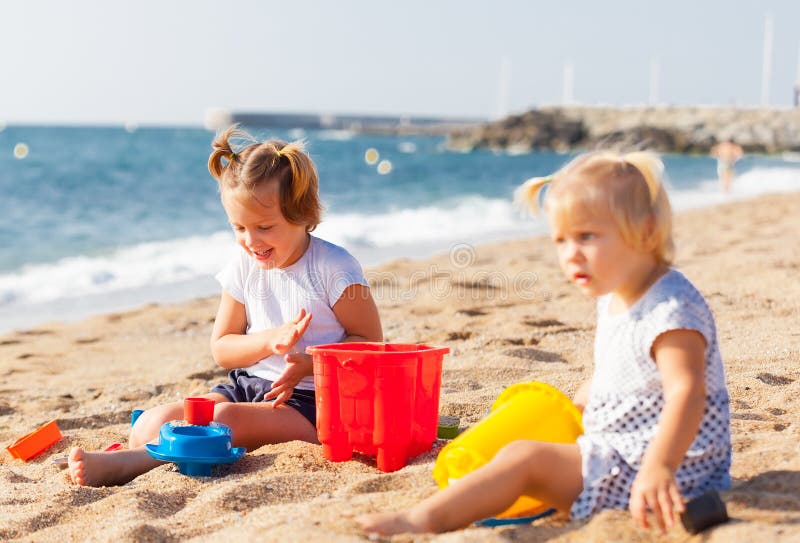 Cute Girls Playing On Beach Stock Image - Image of happy, vacation ...