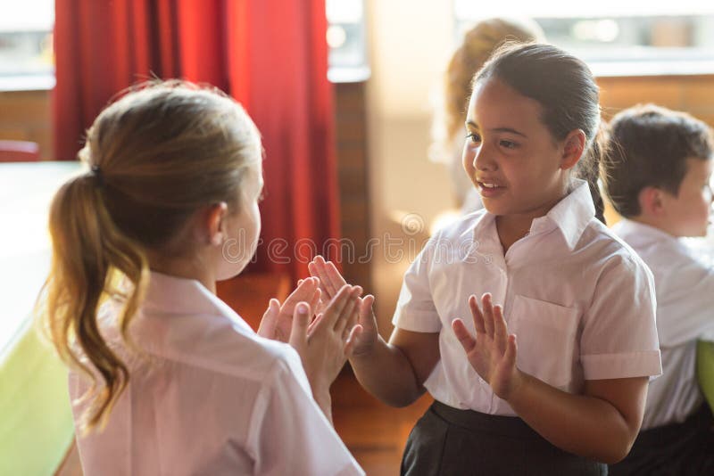 Cute Girls Playing Clapping Game Stock Photo - Image of motion ...