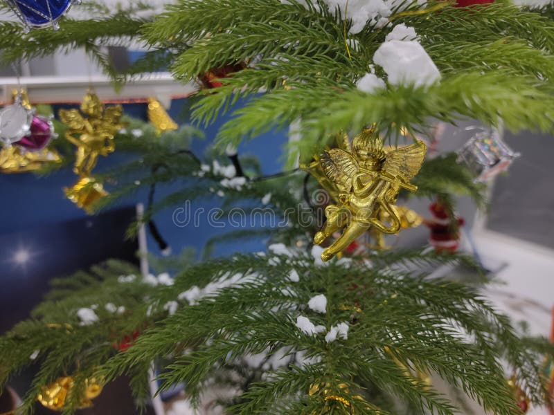 Cute Gold Angel Pendant on a Pine Tree Stock Photo - Image of pendant ...