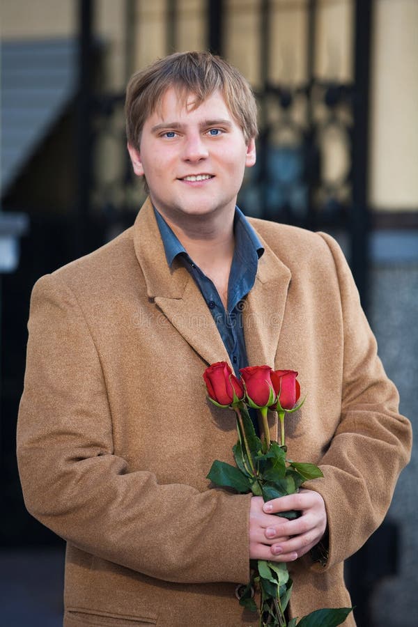 Cute guy and flowers stock photo. Image of male, love - 11760962