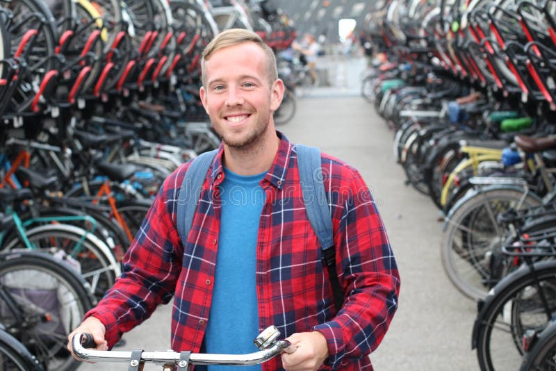 Cute Guy in Modern Bicycle Parking Lot Stock Photo - Image of outdoors ...