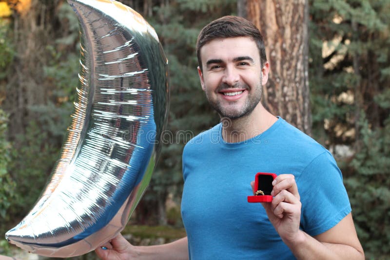 Cute Guy Proposing with Heart Balloon Stock Photo - Image of happy ...