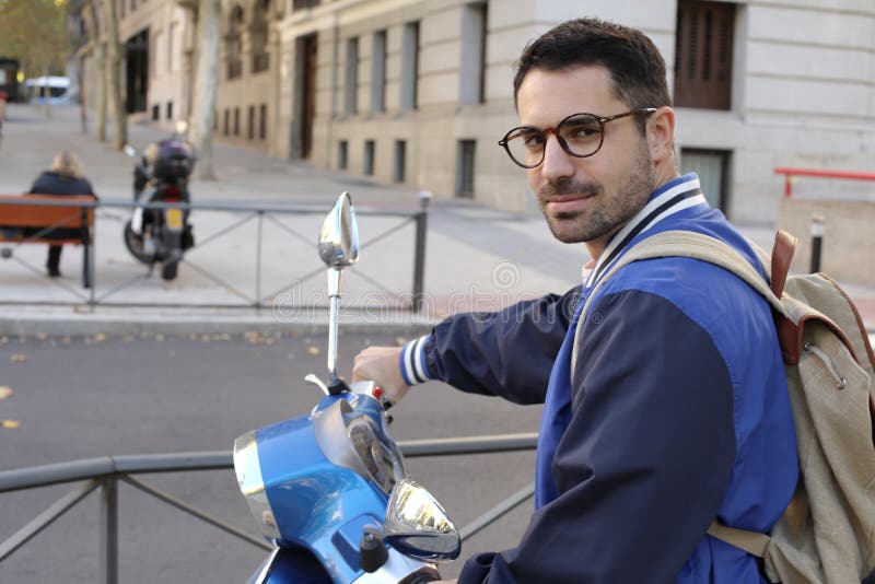 Cute guy riding a vespa stock photo. Image of male, automotive - 243986876
