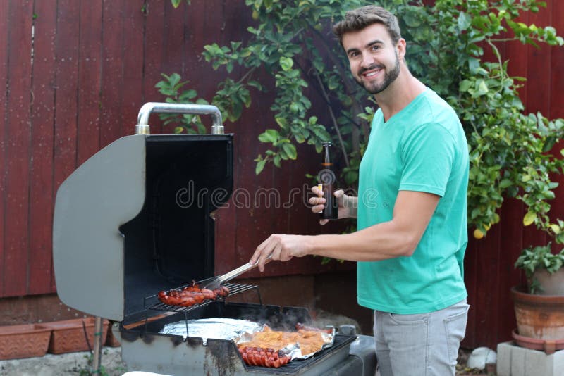 Cute Guy Smiling and Cooking on the Barbecue Grill Stock Image - Image ...