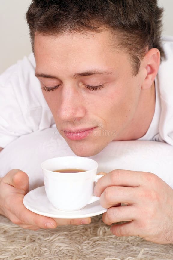 Cute guy with tea stock photo. Image of thinking, carpet - 23869402