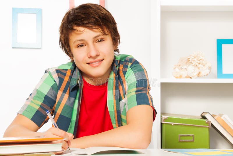 Cute Handsome Boy Write in Textbook and Smile Stock Photo - Image of ...