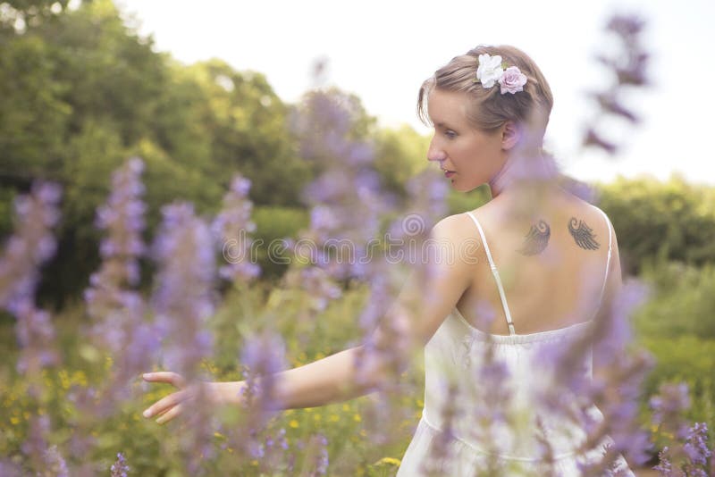 Cute Happy Caucasian Woman With Short Haircut In White Dress In Stock