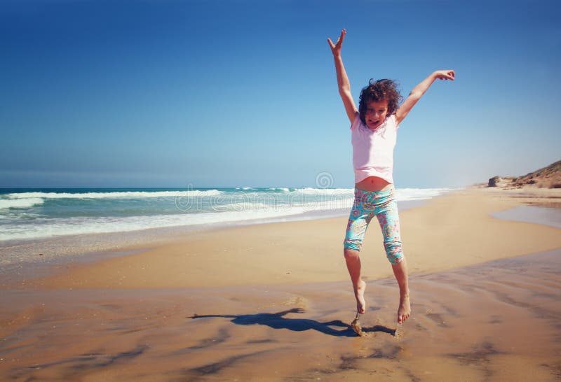 Cute Happy Kid (girl) Playing at the Beach Stock Image - Image of ...