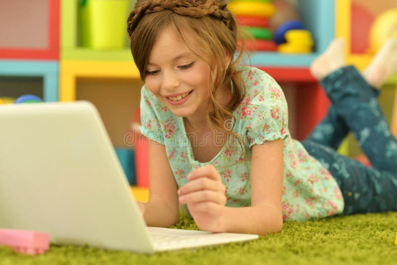Cute and Happy Little Girl Children Using Laptop Computer Stock Photo ...
