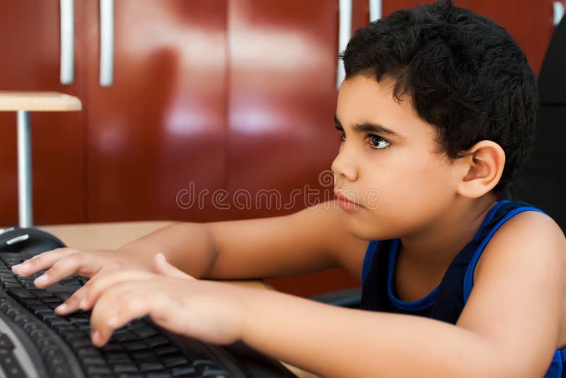 Cute Hispanic Boy Typing on a Computer Stock Photo - Image of learn ...