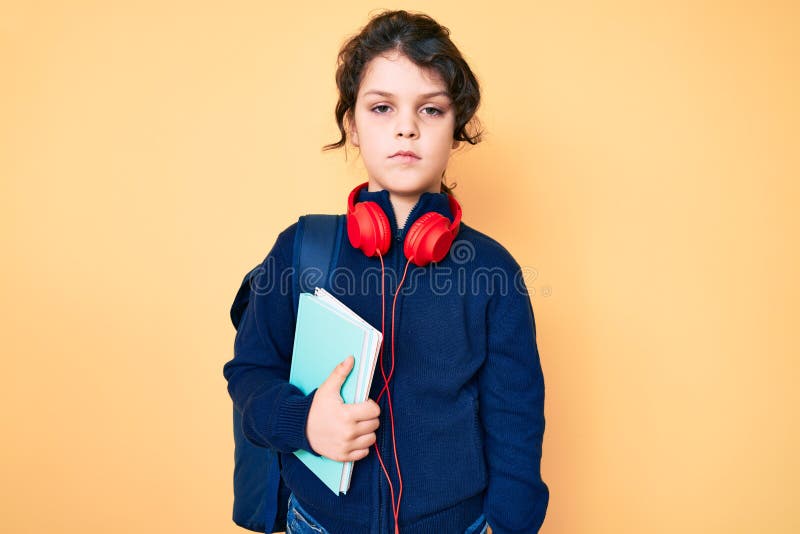 Cute Hispanic Child Holding Student Backpack and Books Thinking ...