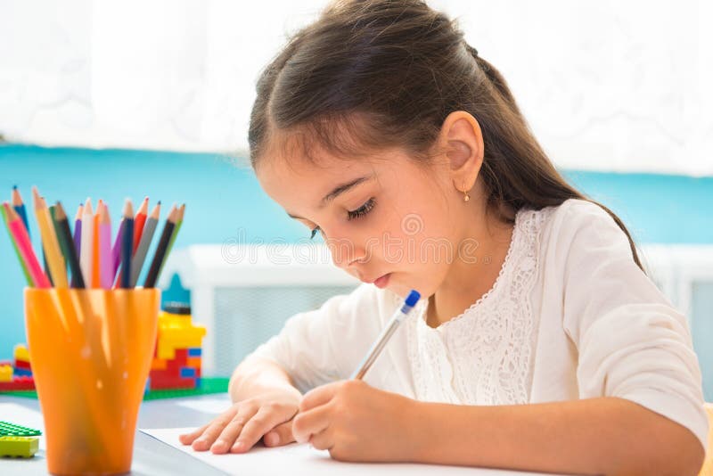 Cute Hispanic Girl Writing at School Stock Image - Image of education ...