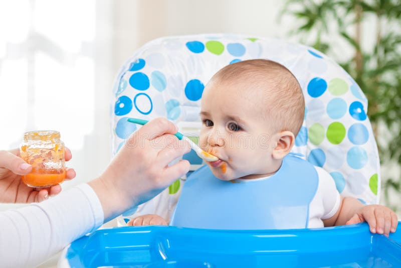 Cute Hungry Baby Eating Fruit Mash Stock Image - Image of child, food ...