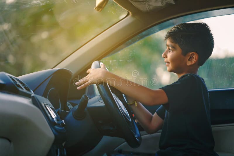 Cute Indian child in car stock image. Image of smile - 150500661