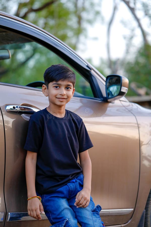 Cute Indian child with car stock photo. Image of school - 150502544