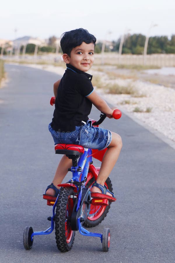 Cute Indian Toddler Riding a Bicycle with Smile Stock Image - Image of ...