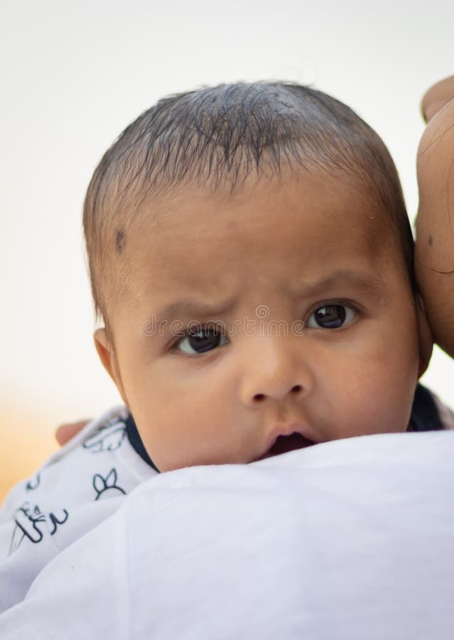 Cute Infant Facial Expression Resting at Mother Shoulder from Flat ...